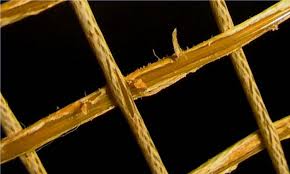 What is the difference between multifilament and poly strings?